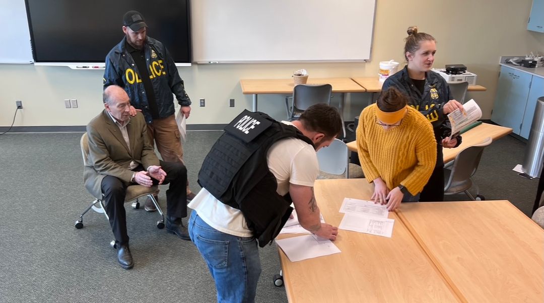 Under arrest: UAA students participate in mock IRS tax fraud investigation